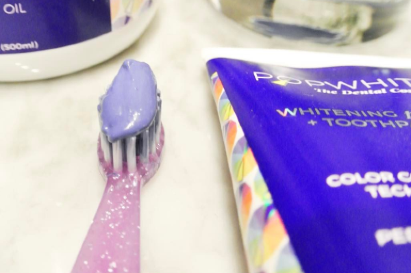 This purple toothpaste whitens your teeth, and the results are...
